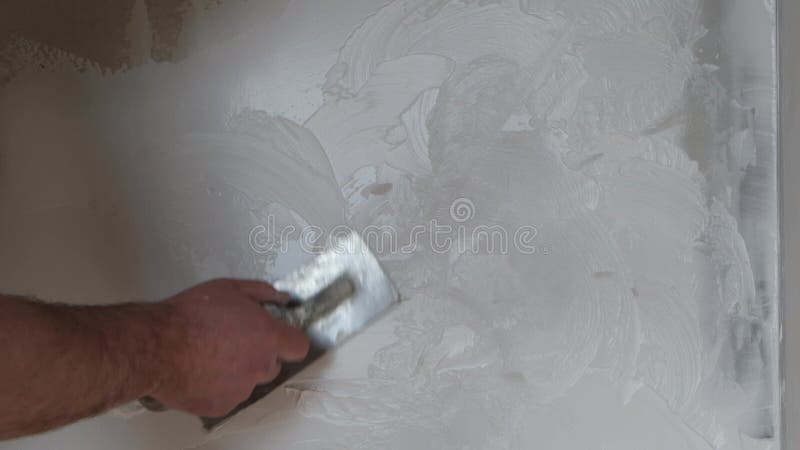 Applying Decorative Putty. White Abstract Texture of Surface Covered ...