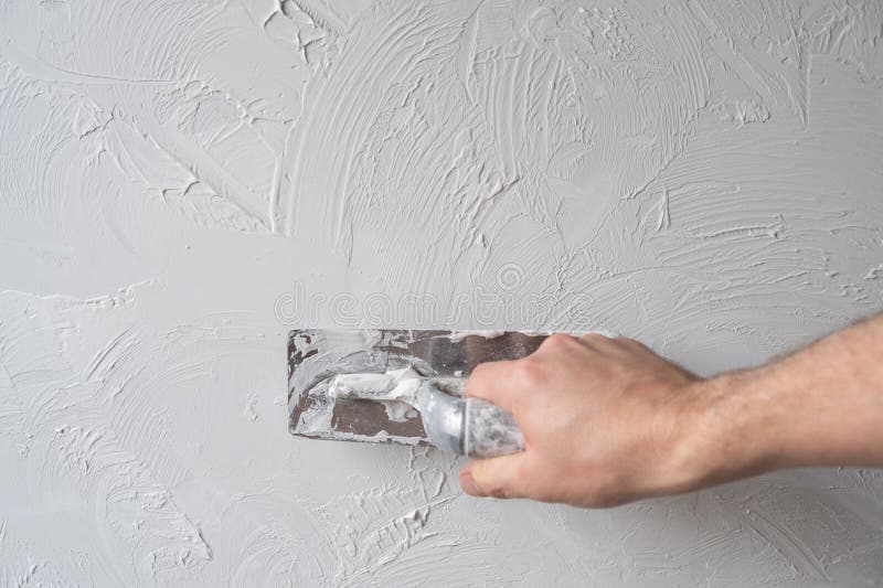 Applying Decorative Putty. White Abstract Texture of Surface Covered ...