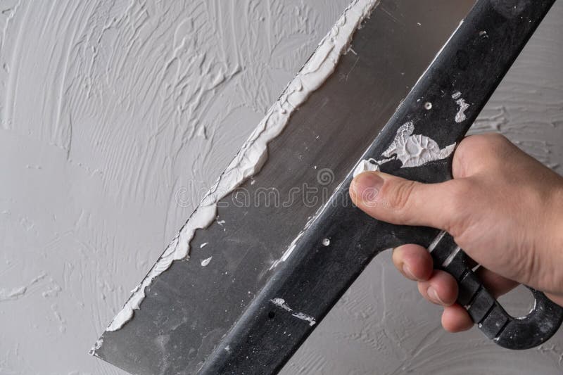 Applying Decorative Putty. White Abstract Texture of Surface Covered ...