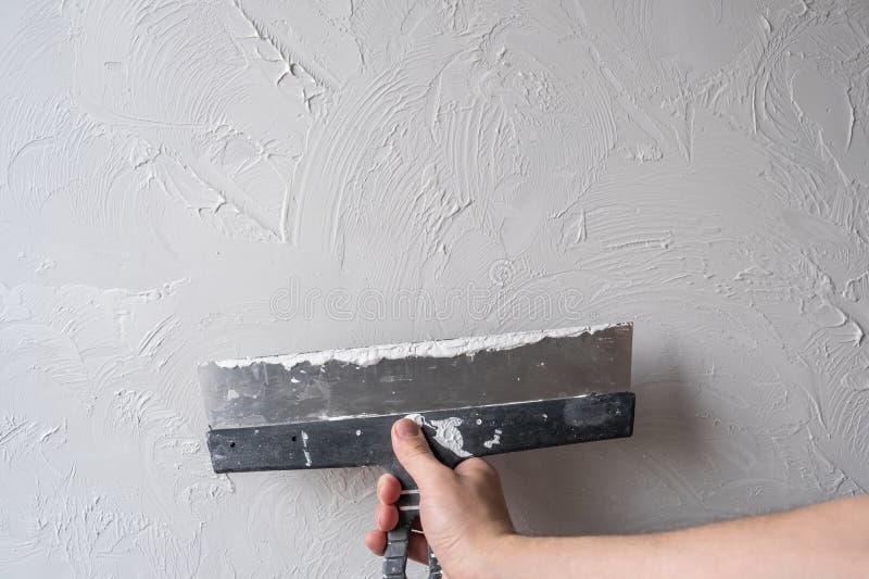 Applying Decorative Putty. White Abstract Texture of Surface Covered ...