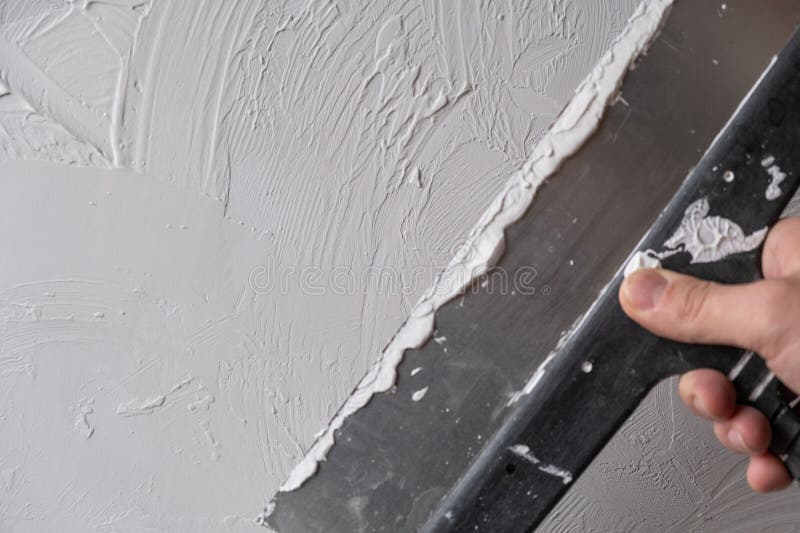 Applying Decorative Putty. White Abstract Texture of Surface Covered ...