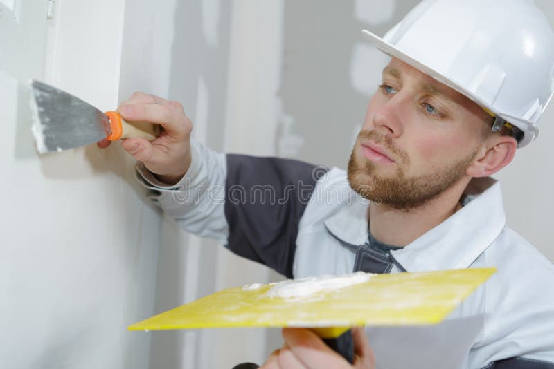 Applying Finishing Touch on Wall Stock Image - Image of renovation ...