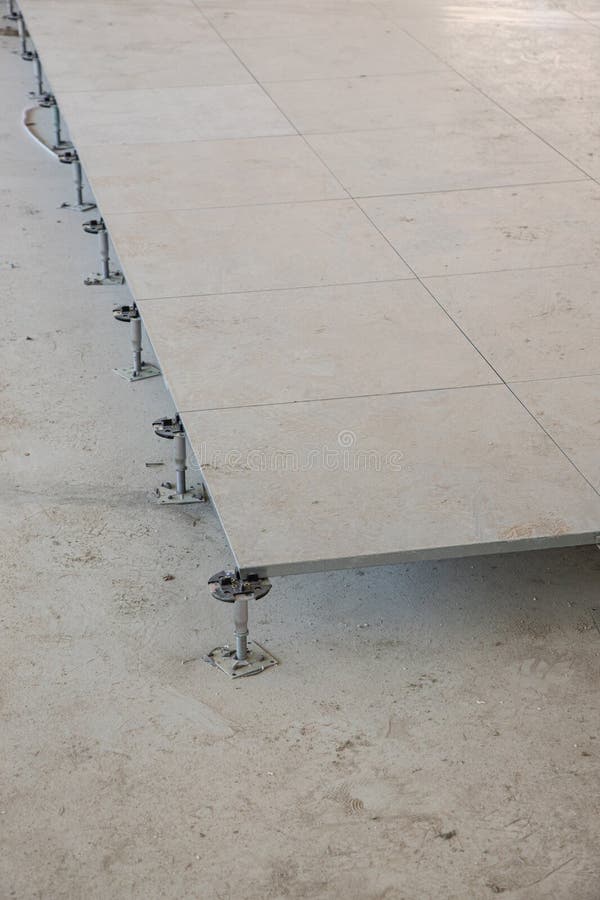 Applying Flooring To a Building Under Construction Stock Photo - Image ...