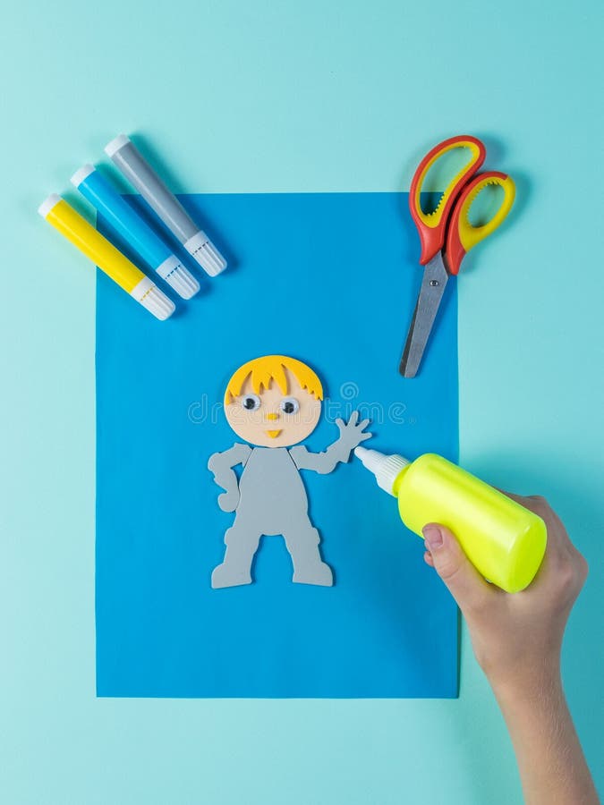 Applying Glue To an Application Made of Paper with the Image of a Man ...