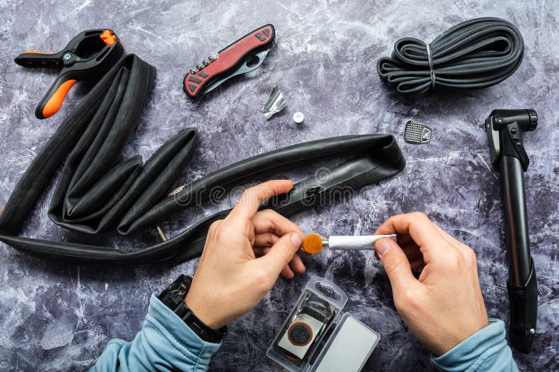Applying Glue To the Prepared Patch. Patch for Repairing Tube.Rubber ... Applying Glue To the Prepared Patch. Patch for Repairing Tube.Rubber ...