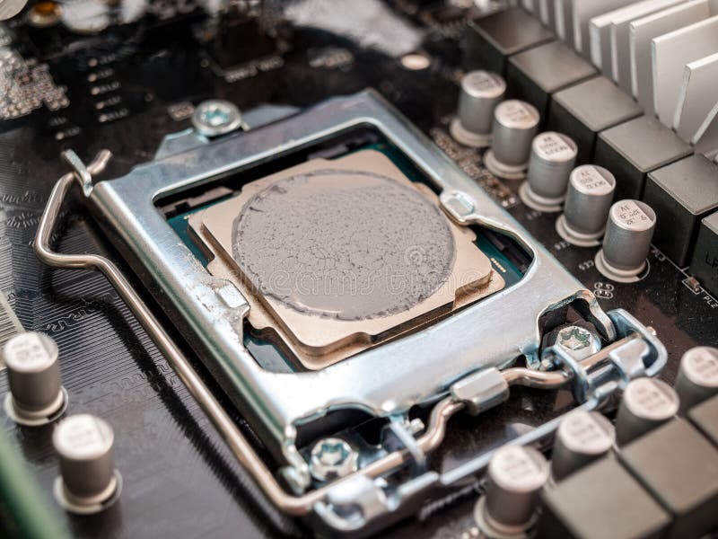 Applying a Heat-conducting Paste To the Heat Distributor, the Cover of ...