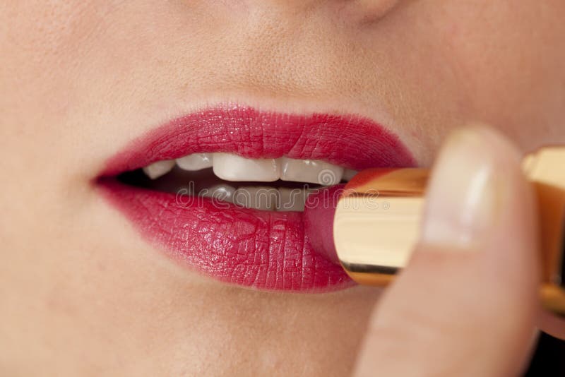 Applying lipstick stock image. Image of human, cosmetics - 27761541