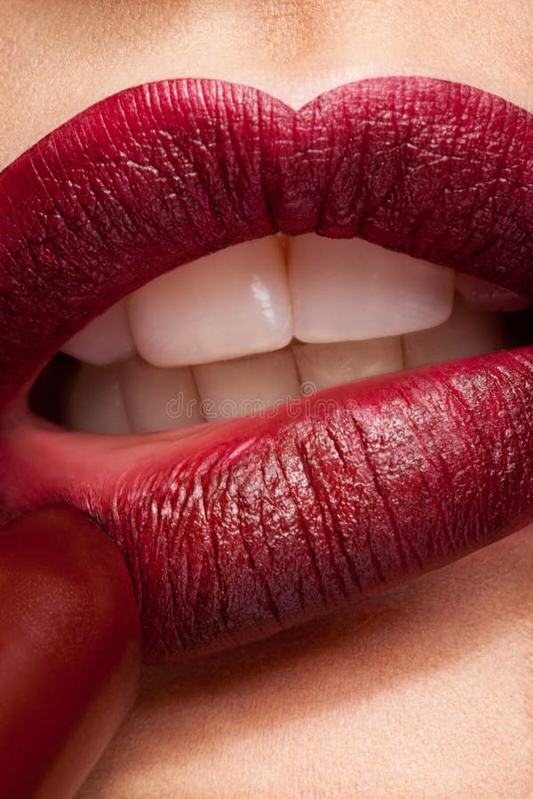 Applying Lipstick on Red Lips in really Close Up Photo Stock Image ...