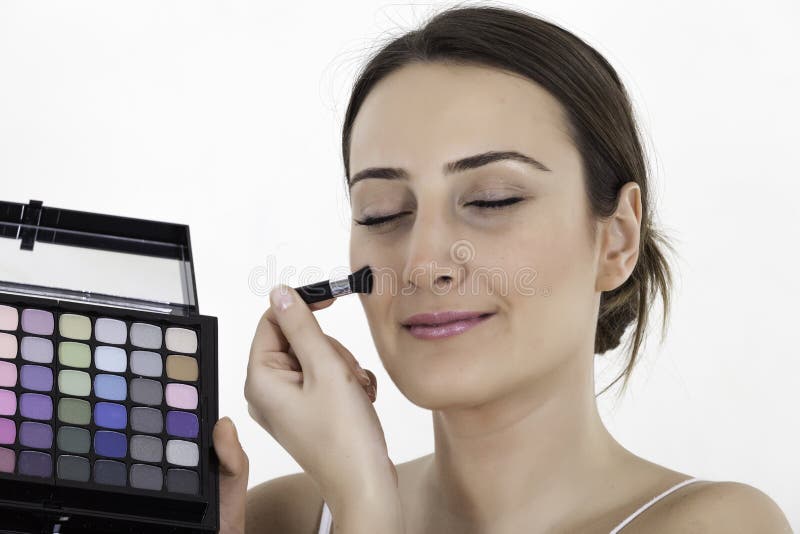 Applying make-up stock photo. Image of brunette, facial - 38001158
