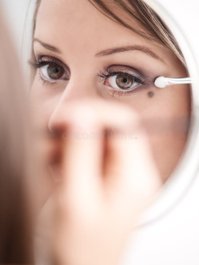 Applying make-up stock image. Image of reflection, face - 58497089