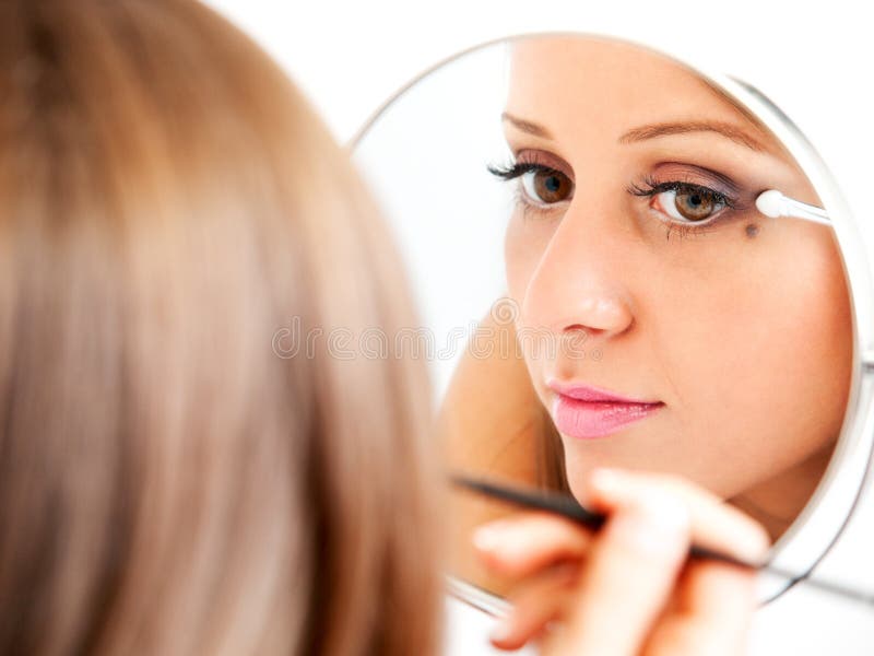 Applying make-up stock image. Image of young, face, attractive - 61094207