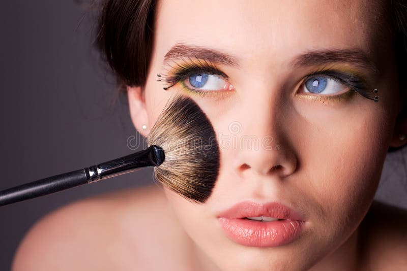Applying Makeup stock image. Image of glam, glamour, brush - 13410477