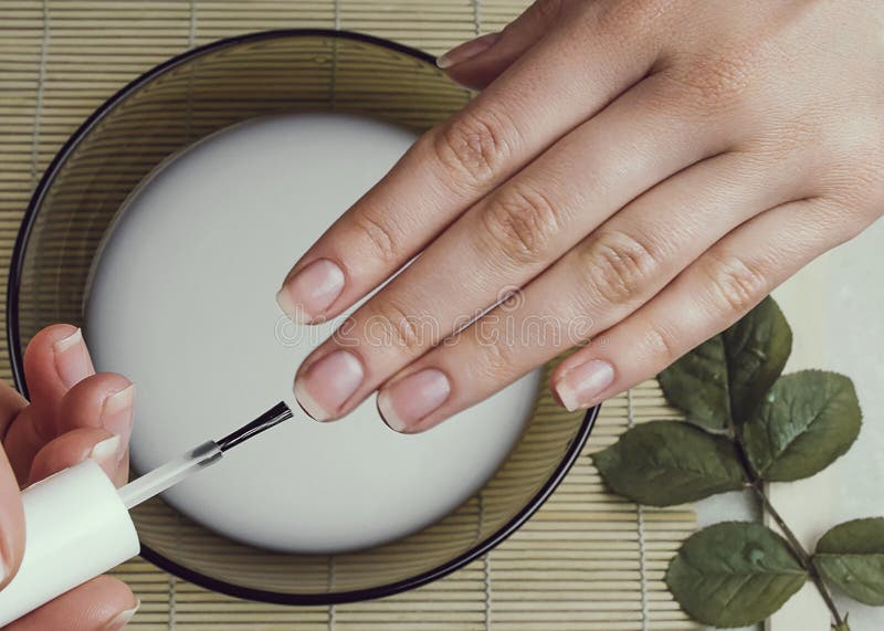 Applying a nail polish stock photo. Image of nail, manicure - 94361068