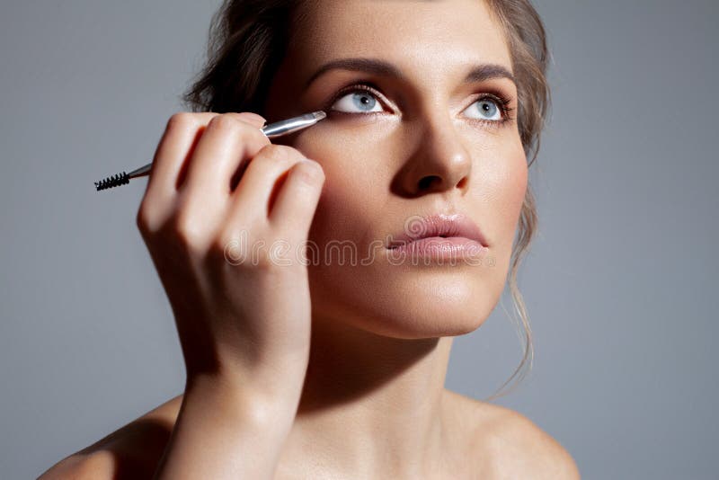 Applying Natural Makeup on Beautiful Woman Stock Image - Image of ...