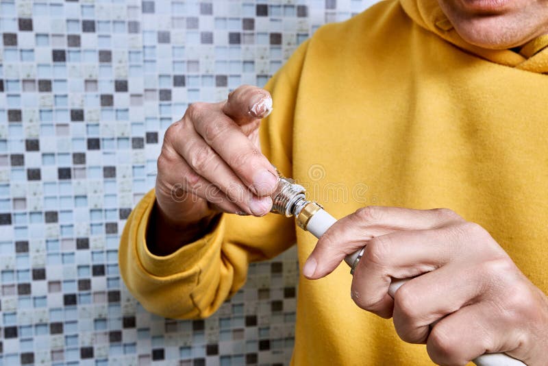 Applying Plumbing Paste To Fitting, Plumber Prepares Compression ...