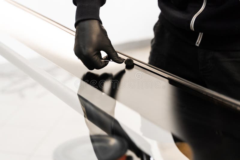 Applying Primer on Car Frame before Windshield Installation. Applying ...