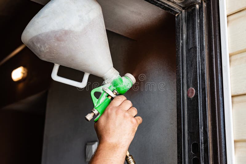 Applying a Primer To the Wall Using Spray Gun. Stock Image - Image of ...