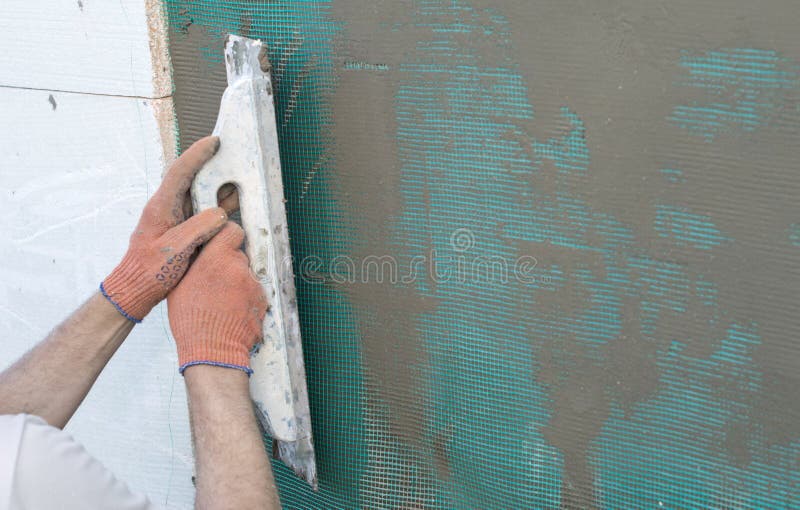 Applying Putty To the Wall Using a Spatula Stock Image - Image of ...