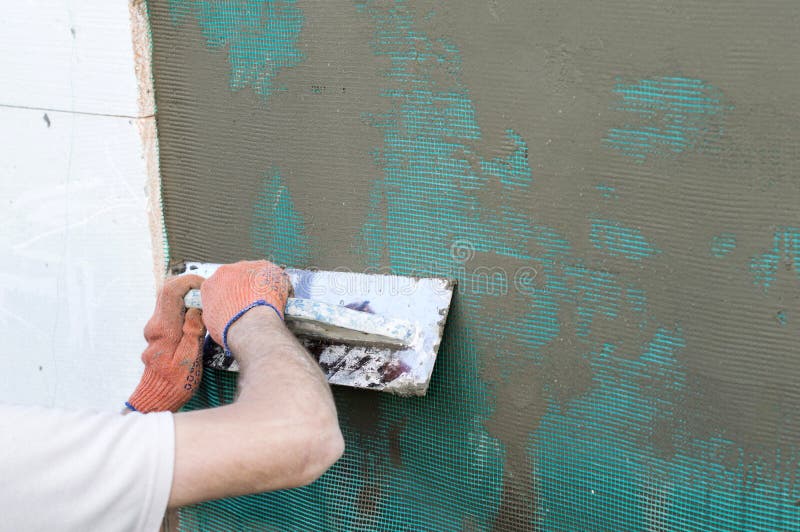 Applying Putty To the Wall Using a Spatula Stock Photo - Image of putty ...