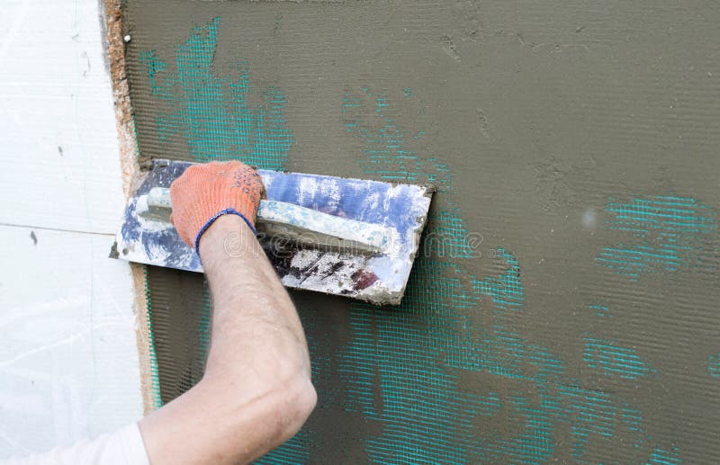Applying Putty To the Wall Using a Spatula Stock Image - Image of ...