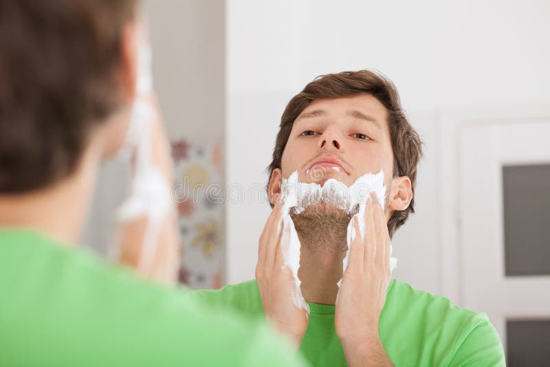 Applying shaving cream stock photo. Image of hands, care - 36571514
