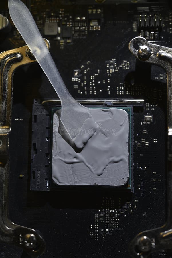 Applying Thermal Paste To the Surface of the Computer Processor ...