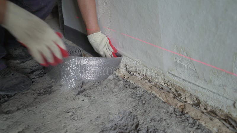 Applying a Waterproofing Tape To the Joint between the Wall and the ...