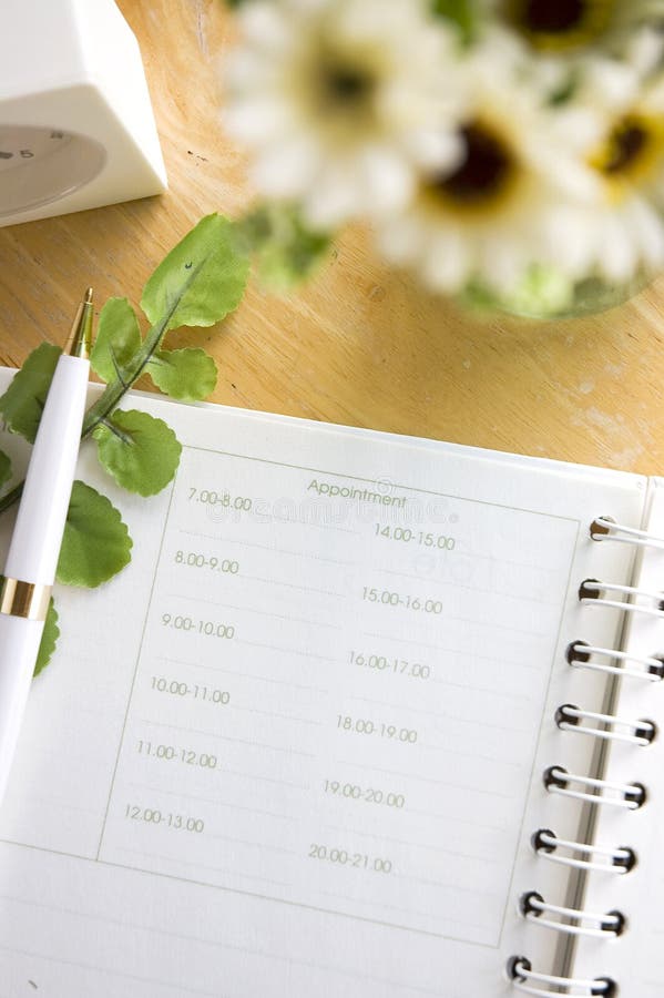 Appointment book on desk stock photo. Image of flowers - 45896094