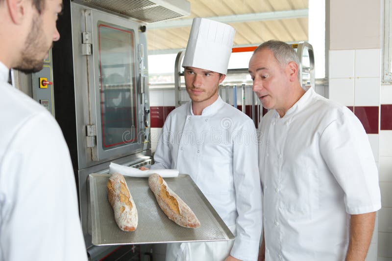 Apprentice Baker in Bakehouse with Tray Bread Stock Photo - Image of ...
