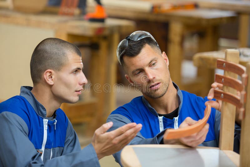 Apprentice Carpenter Working on Chair with Foreman Stock Image - Image ...