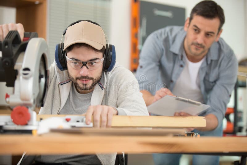 Apprentice Carpenter Working in Workshop Stock Image - Image of working ...
