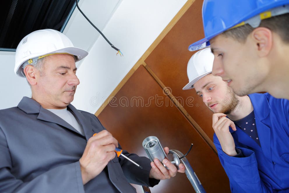 Apprentice Cctv Technician Working Stock Image - Image of caucasian ...