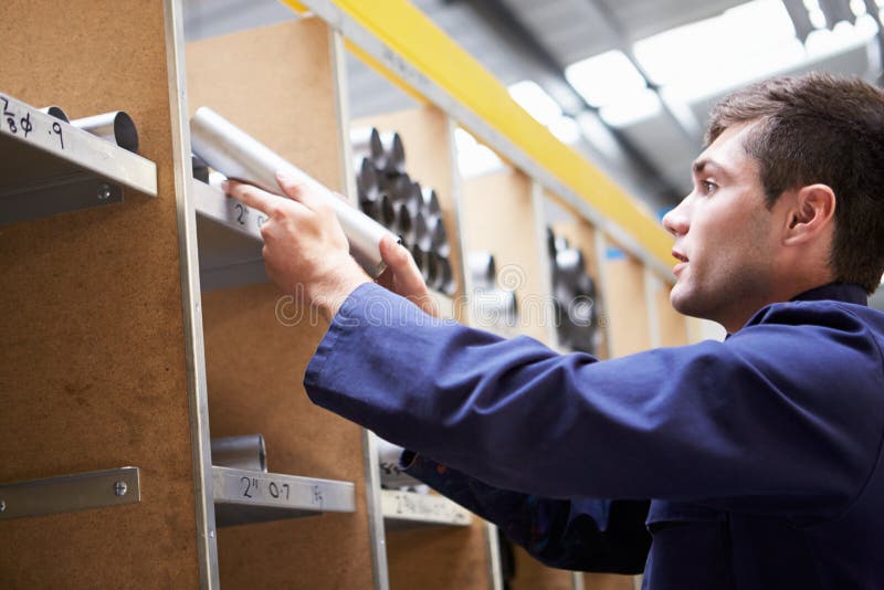 Apprentice Checking Stock Levels in Store Room Stock Photo - Image of ...
