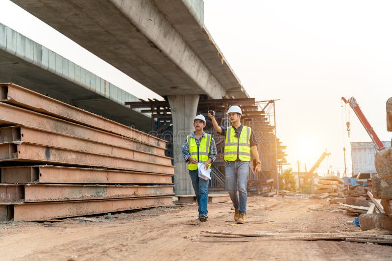 Apprentice and Civil Engineer at Road Construction Site, Industrial ...