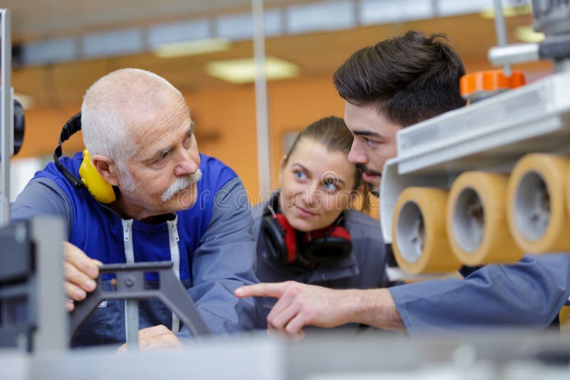 Apprentice Engineer Asking Foreman Question Stock Image - Image of ...