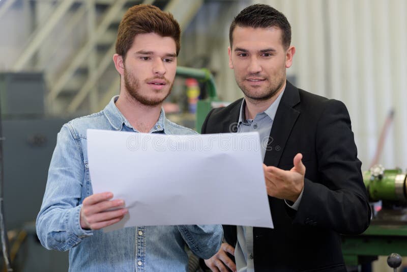 Apprentice Engineer Showing Idea To Mentor Stock Image - Image of ...