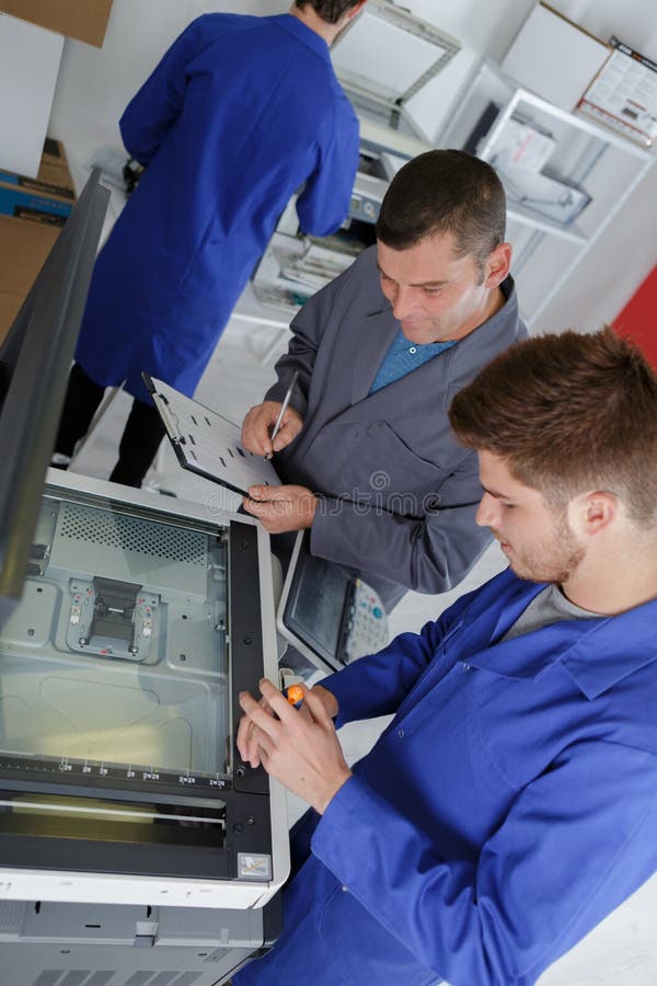 Apprentice Fixing a Printer Stock Photo - Image of apprentice, industry ...