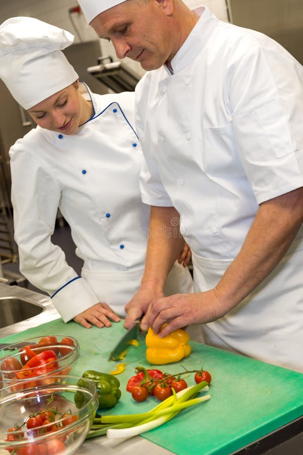 Apprentice Learning Cutting Vegetables from Chef Stock Image - Image of ...