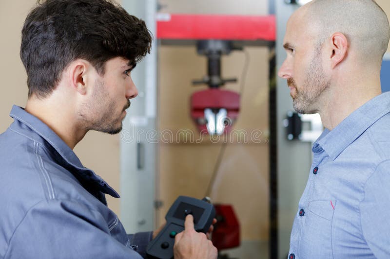 Apprentice Learning How To Use Controls To Machinery Stock Photo ...