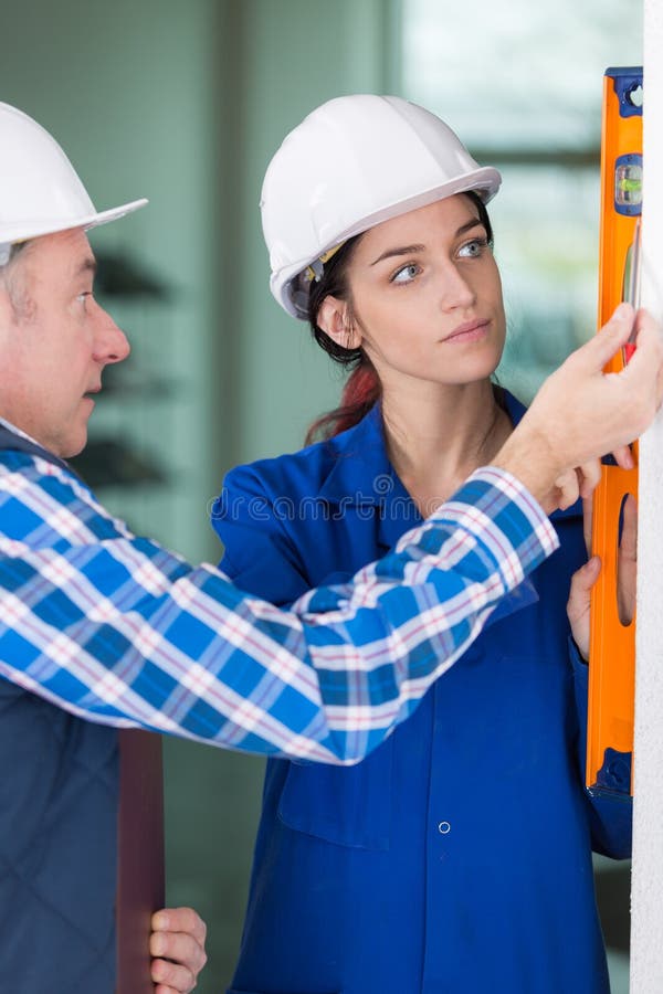 Apprentice Learning How To Use Spirit Level Stock Image - Image of ...
