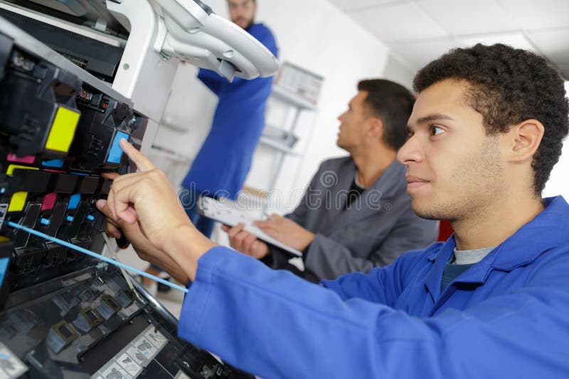 Apprentice Learning To Fix Printer Stock Photo - Image of high, main ...