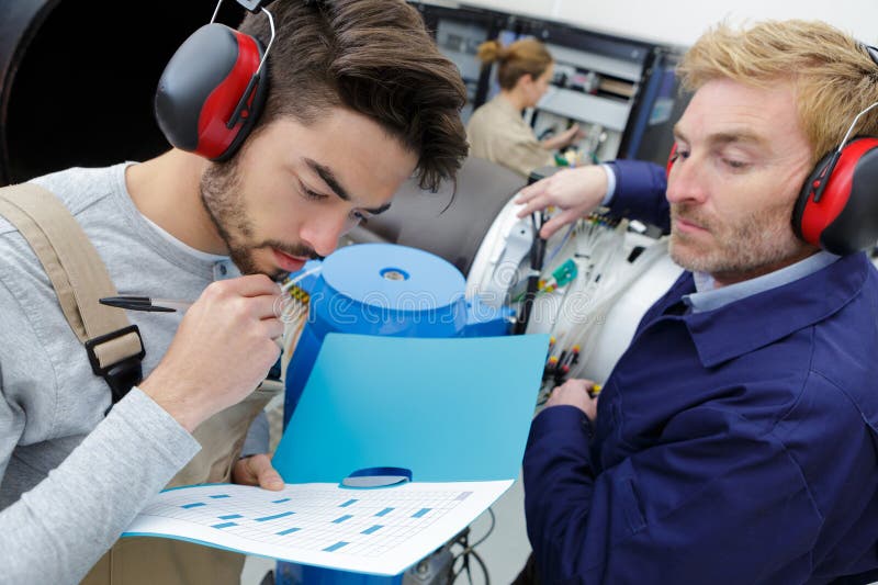 Apprentice Looking at Details on Portfolio Stock Image - Image of ...