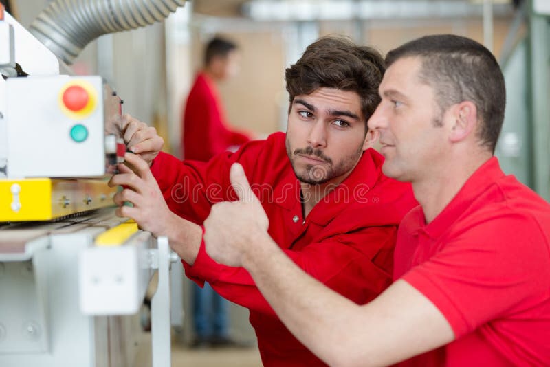 Apprentice Machine Operator in Production Plant Checking Data Stock ...