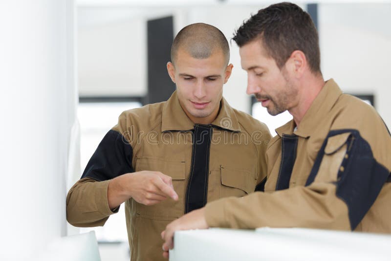 Apprentice Male Builder Sanding Wall Indoors Stock Image - Image of ...