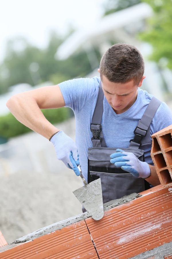 Apprentice of Masonry Laying Bricks Stock Image - Image of training ...