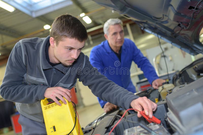 Apprentice Mechanic in Auto Shop Working on Car Engine Stock Image ...