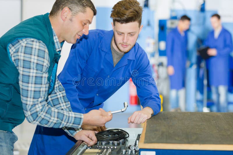 Apprentice Mechanic in Auto Shop Working on Car Engine Stock Image ...