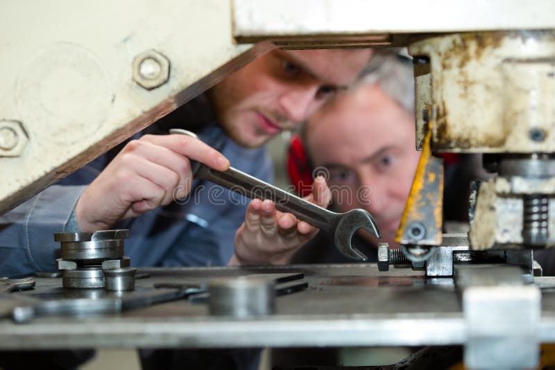 Apprentice Mechanic Working in Auto Repair Shop Stock Image - Image of ...