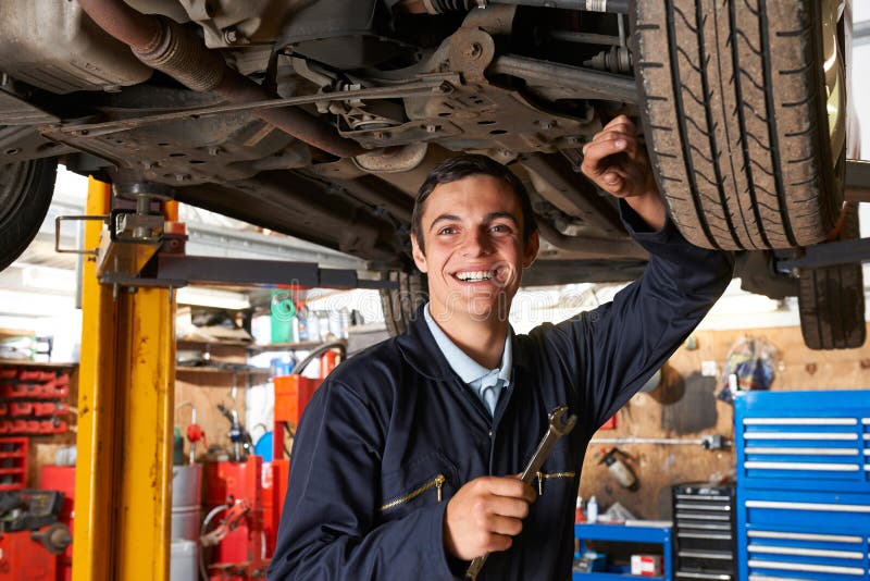 Apprentice Mechanic Working on Car Stock Photo - Image of people, skill ...