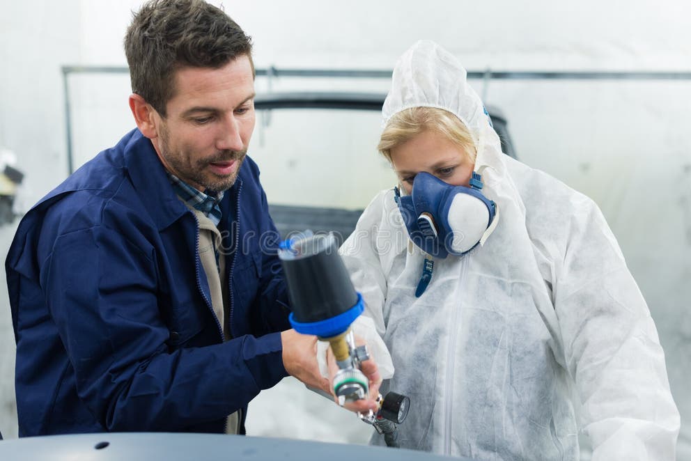 Apprentice Painter with Airgun Spraying Paint Stock Image - Image of repair, spray: 250114505